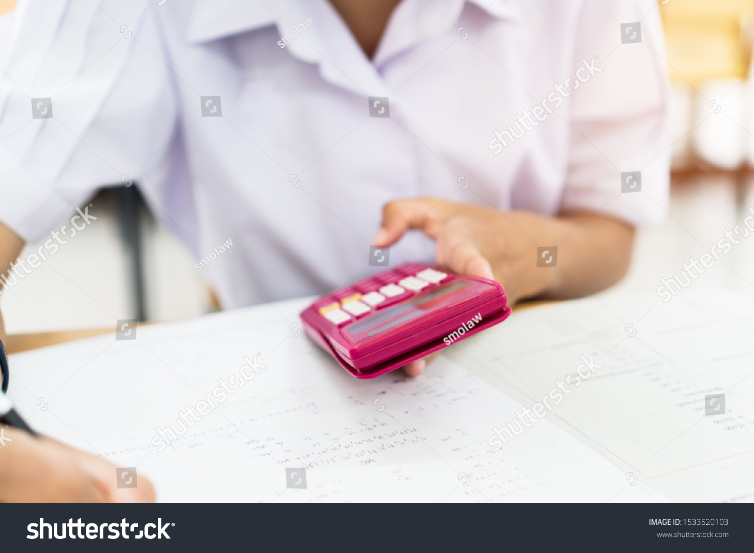 Student Using Calculator For Used Making Mathematical Calculations In ...