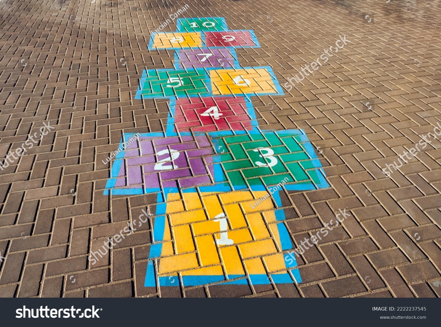 Colorful Childhood Game Hopscotch On Pavement Stock Photo 2222237545 colorful-childhood-game-hopscotch-on-pavement-stock-photo-2222237545