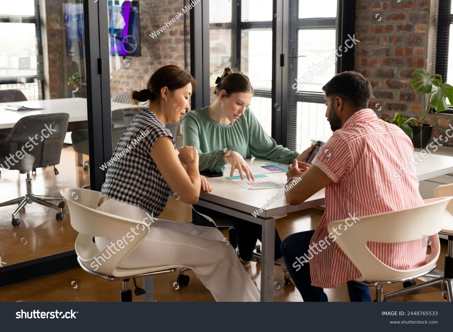 Diverse Team Discussing App Design Office Stock Photo 2448765533 | Shutterstock