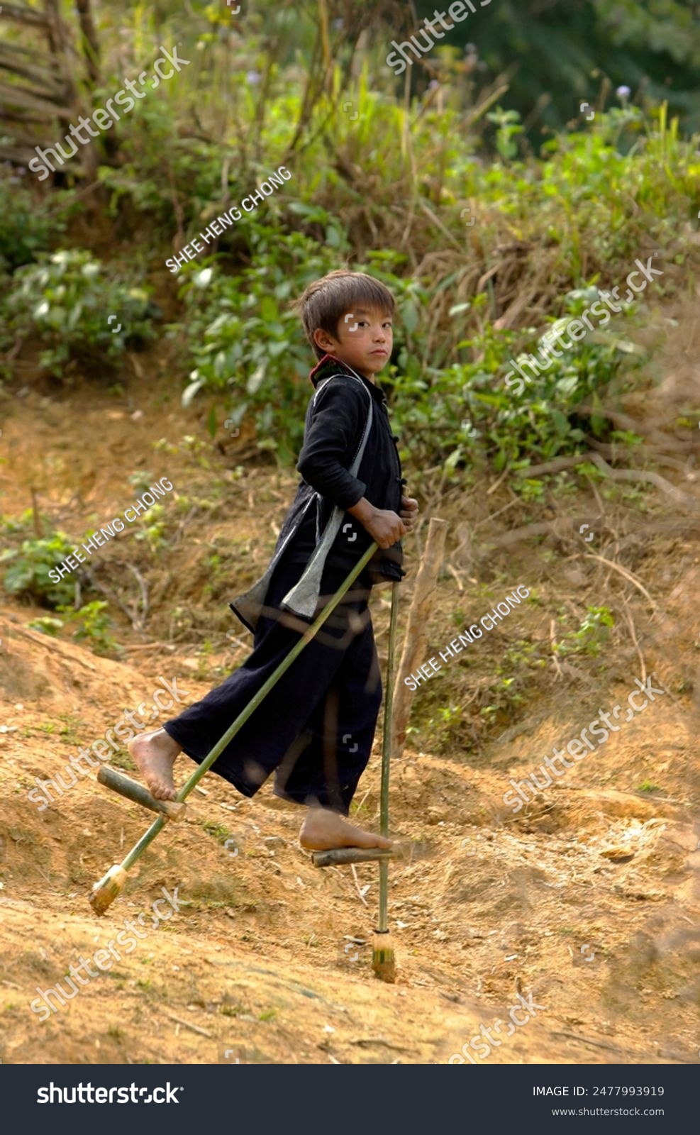 Black Hmong Boy Walks On Stilts Stock Photo 2477993919 | Shutterstock